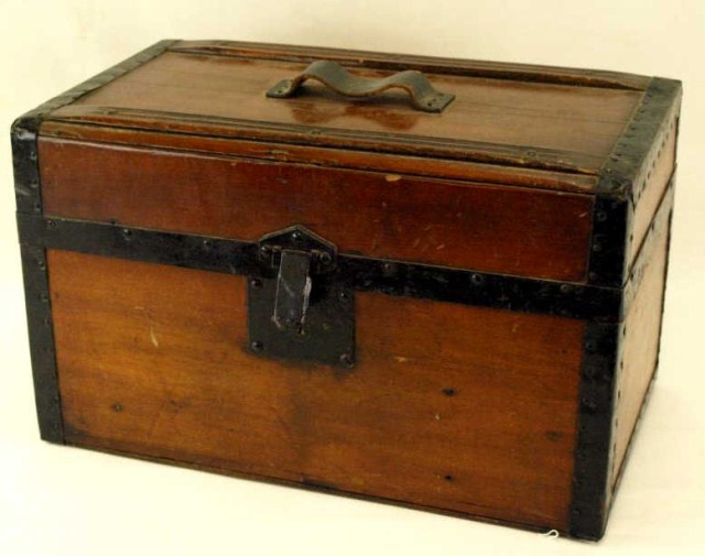 Interesting small antique travel trunk of wood