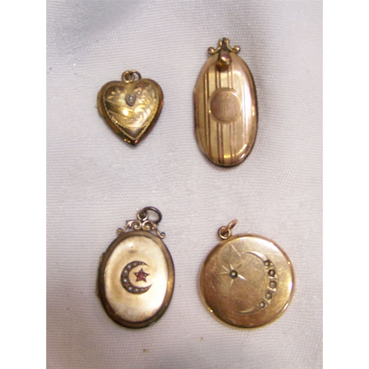 Four Gold Plated Victorian Lockets.