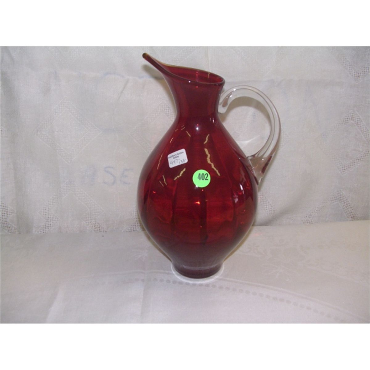 large ruby red glass pitcher