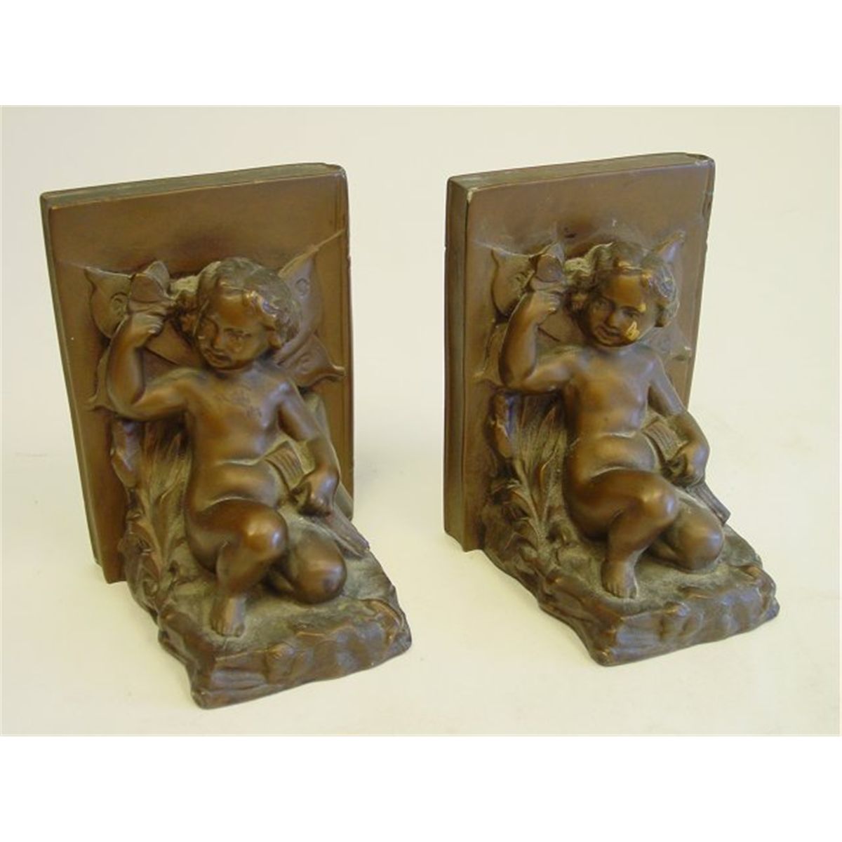 Pair metal "Cherub" bookends with bronze finish