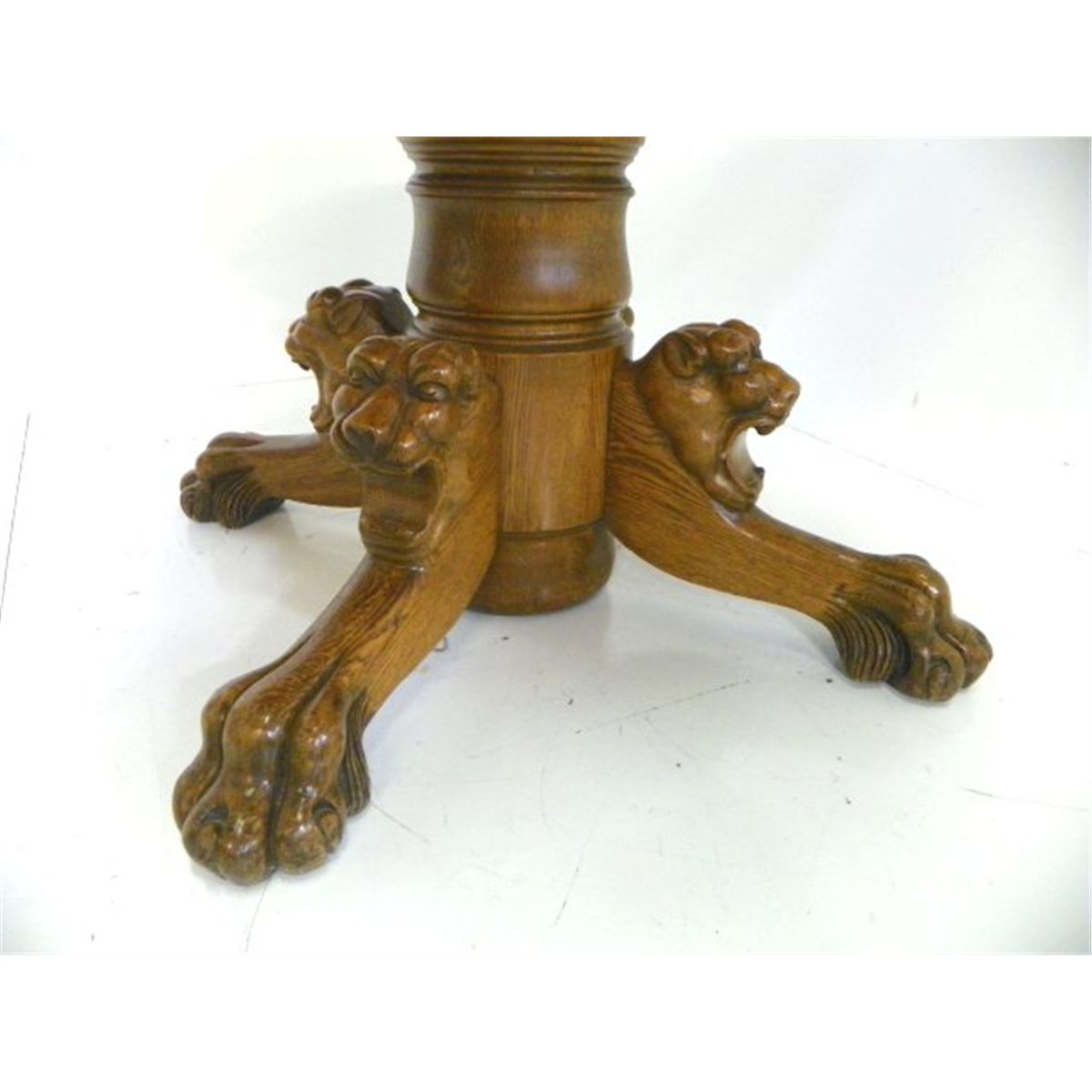 Victorian oak round table with lion head claw base