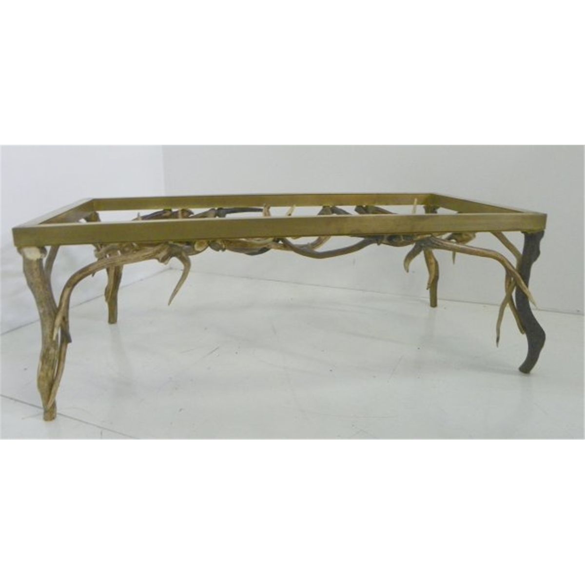 Glass topped coffee table with real antler base