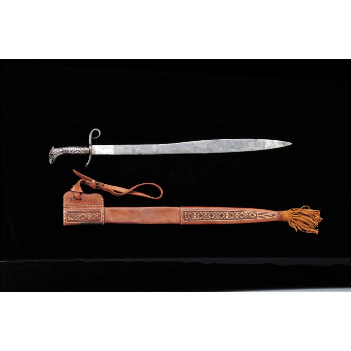 Flamboyant mexican sword with forged steel guard and hilt, showing ...