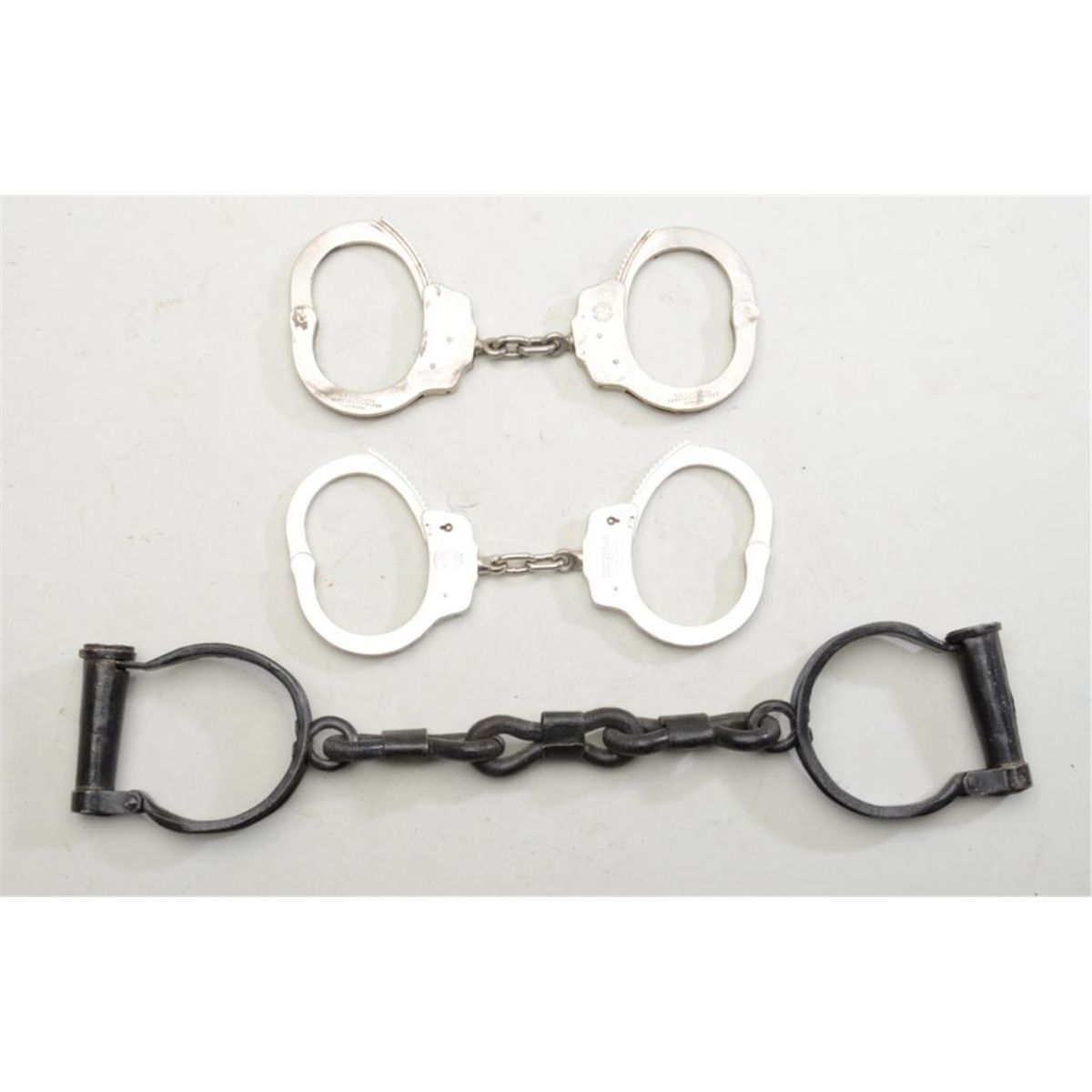 Lot of three pair of handcuffs; no keys; great decorators or props for ...