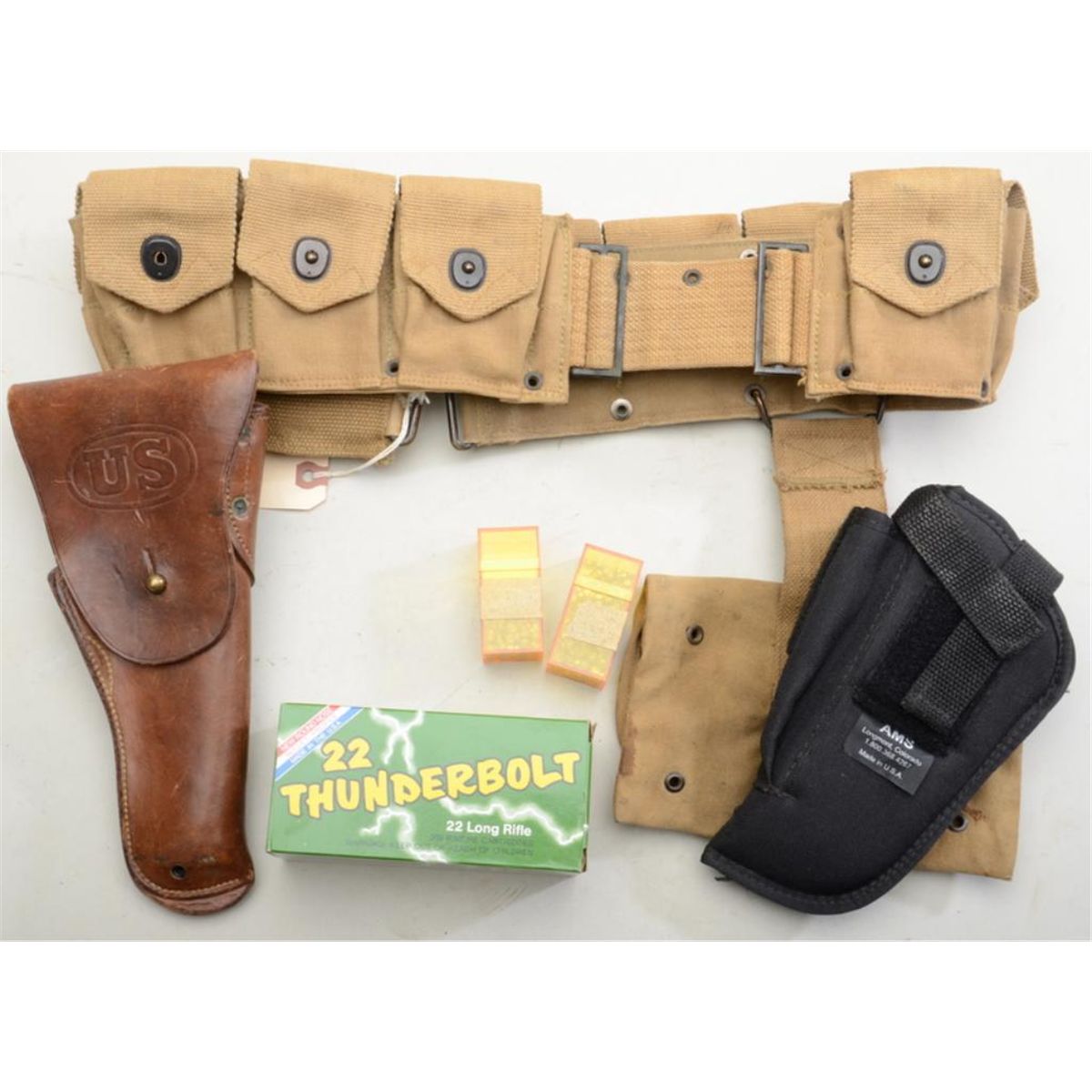 Box lot of misc. U.S. military web gear, holsters, surplus ammo in ...