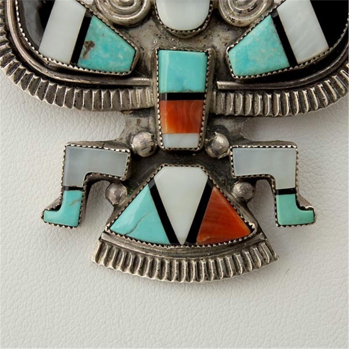ZUNI, SILVER, MULTI-STONE KNIFEWING MAN BROOCH.