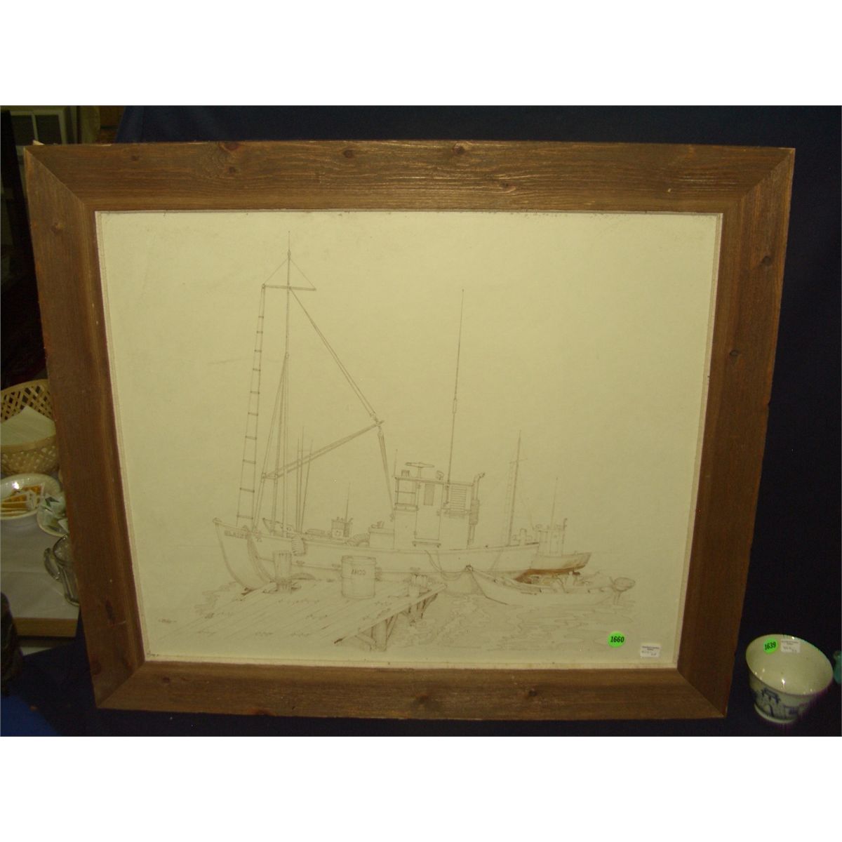 large framed drawing of fishing boat at dock