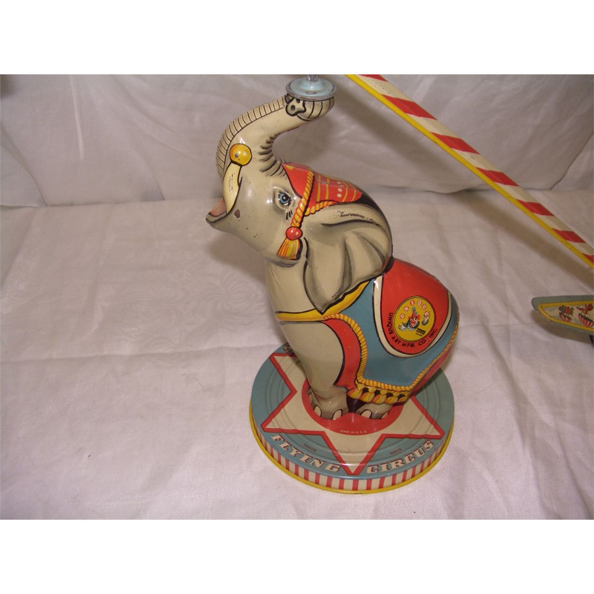 12" tall Unique Art toy Co, rare flying circus wind up toy