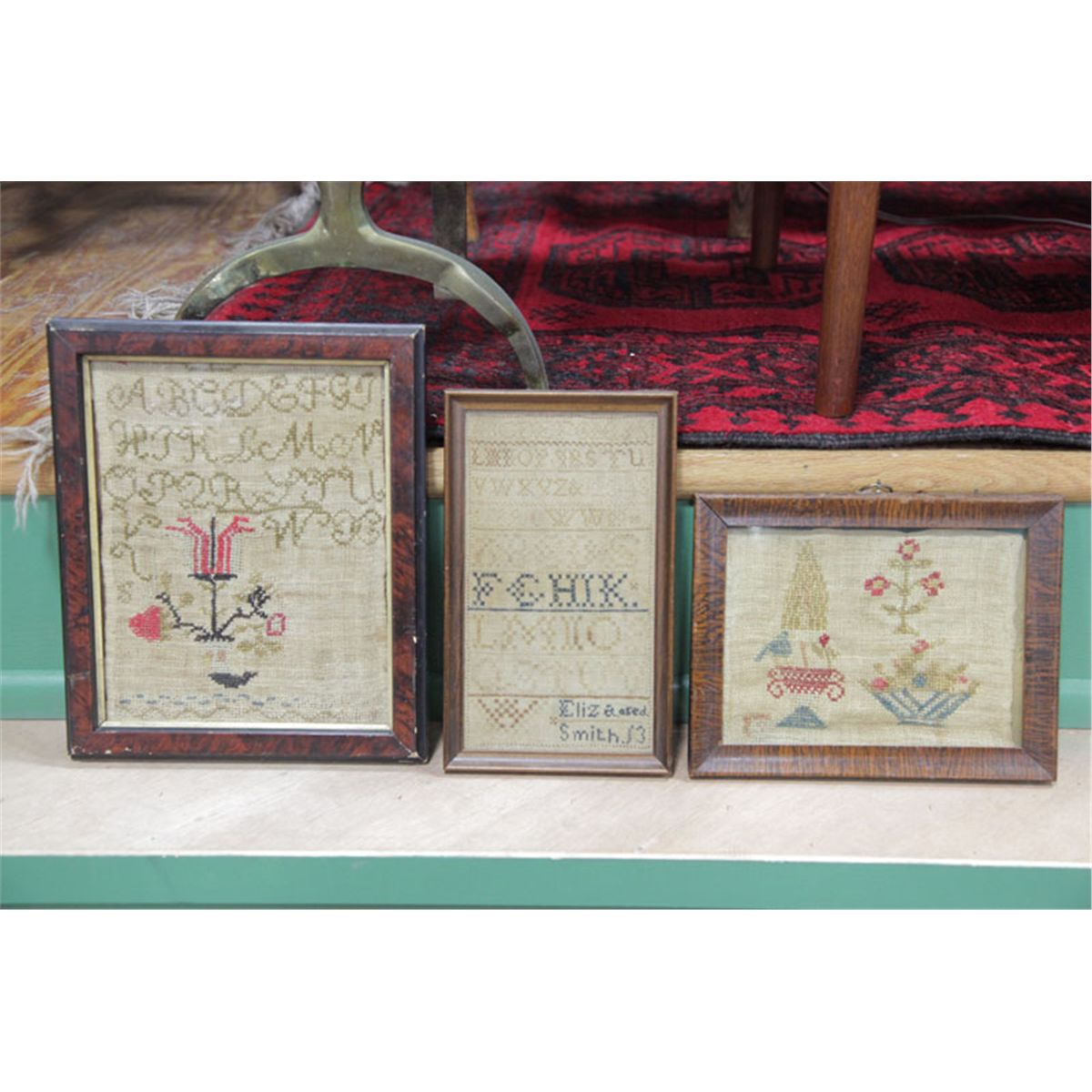 THREE FRAMED SAMPLERS. An alphanumeric marking sampler signed Eliza ...