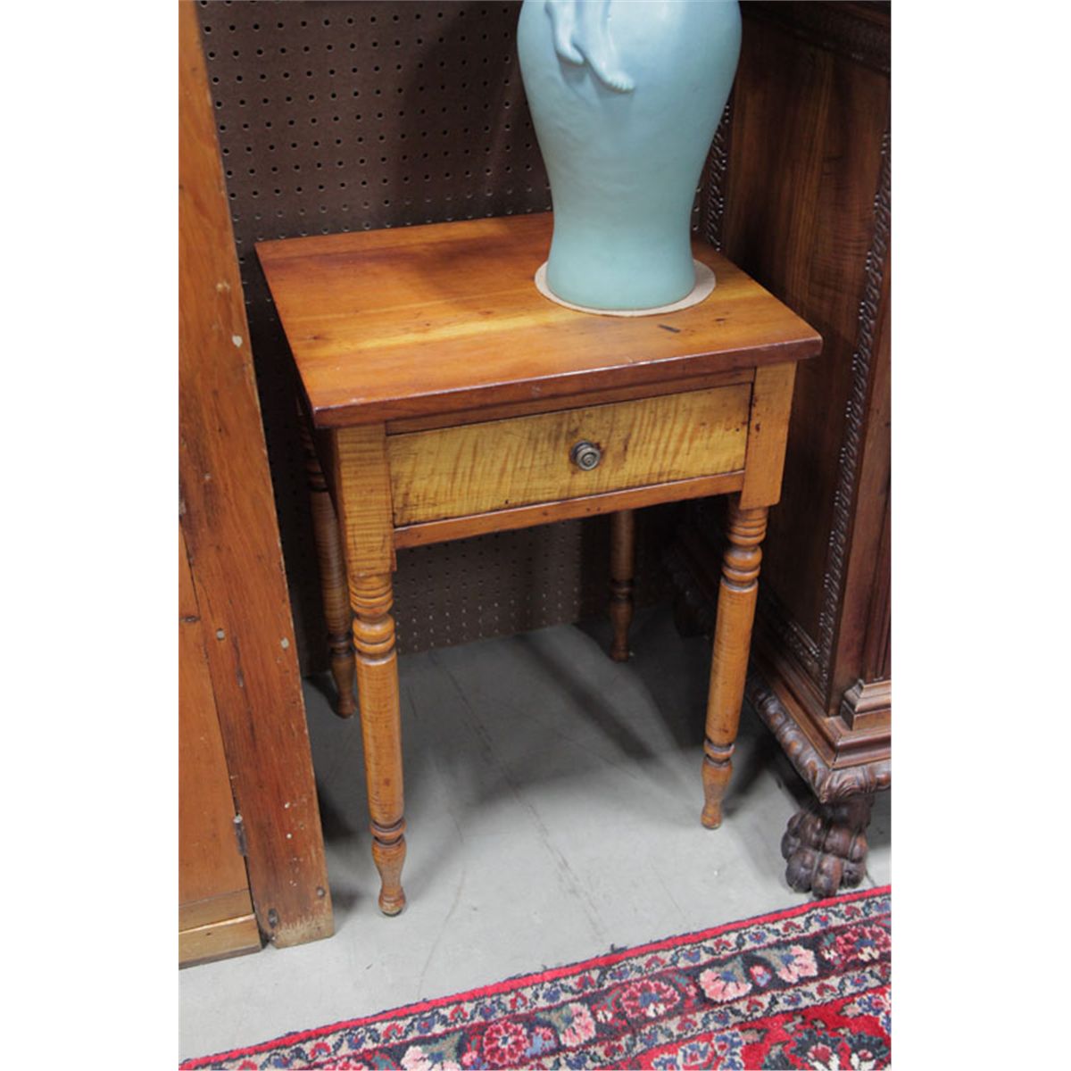 ONE DRAWER STAND. Cherry and curly maple having a metal pull on turned ...