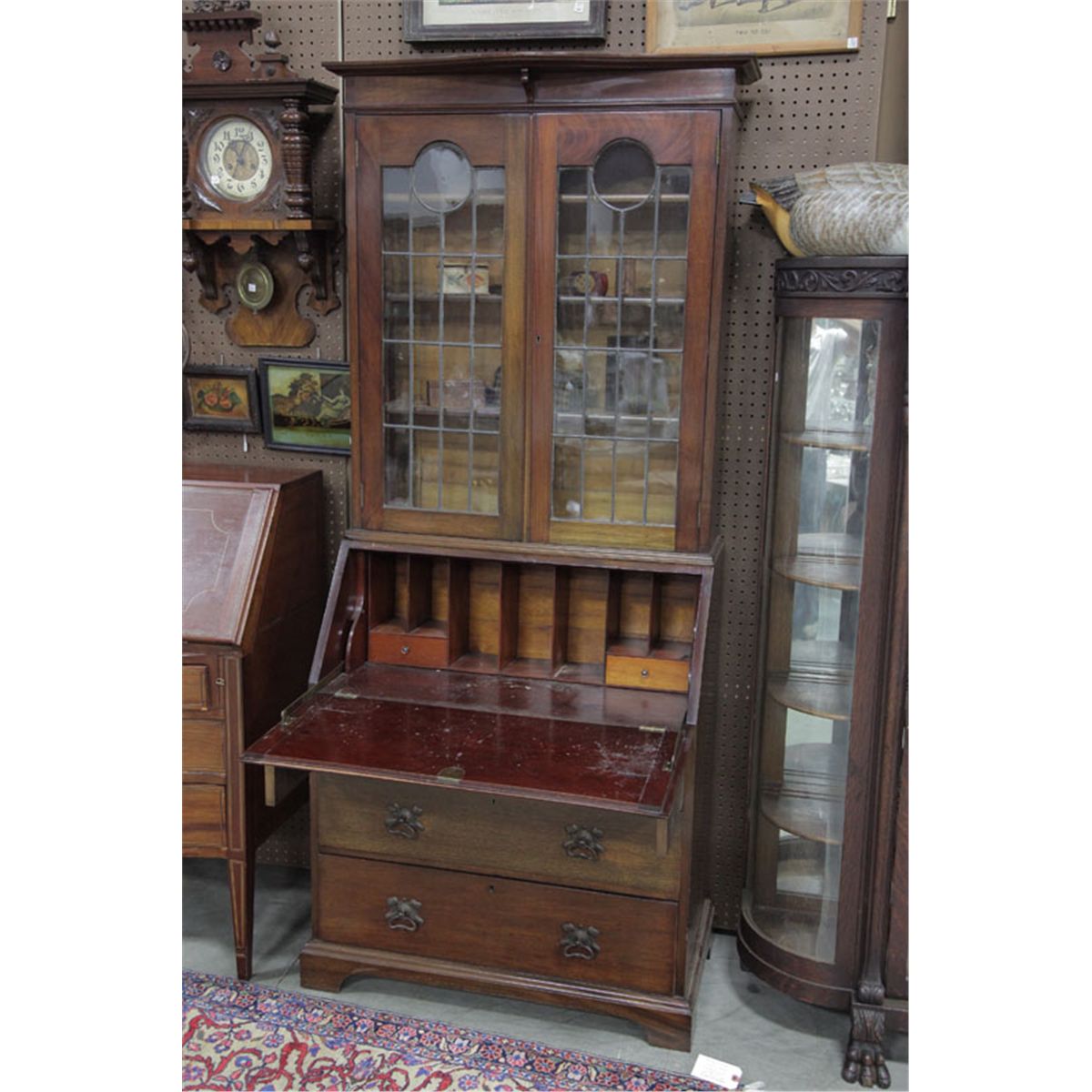 SECRETARY BOOKCASE. Oak having leaded glass doors, paneled drop lid and ...