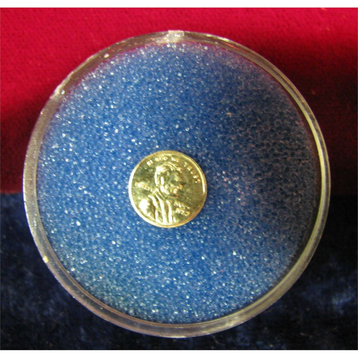 335. Miniature Gold Lincoln Penny in case.