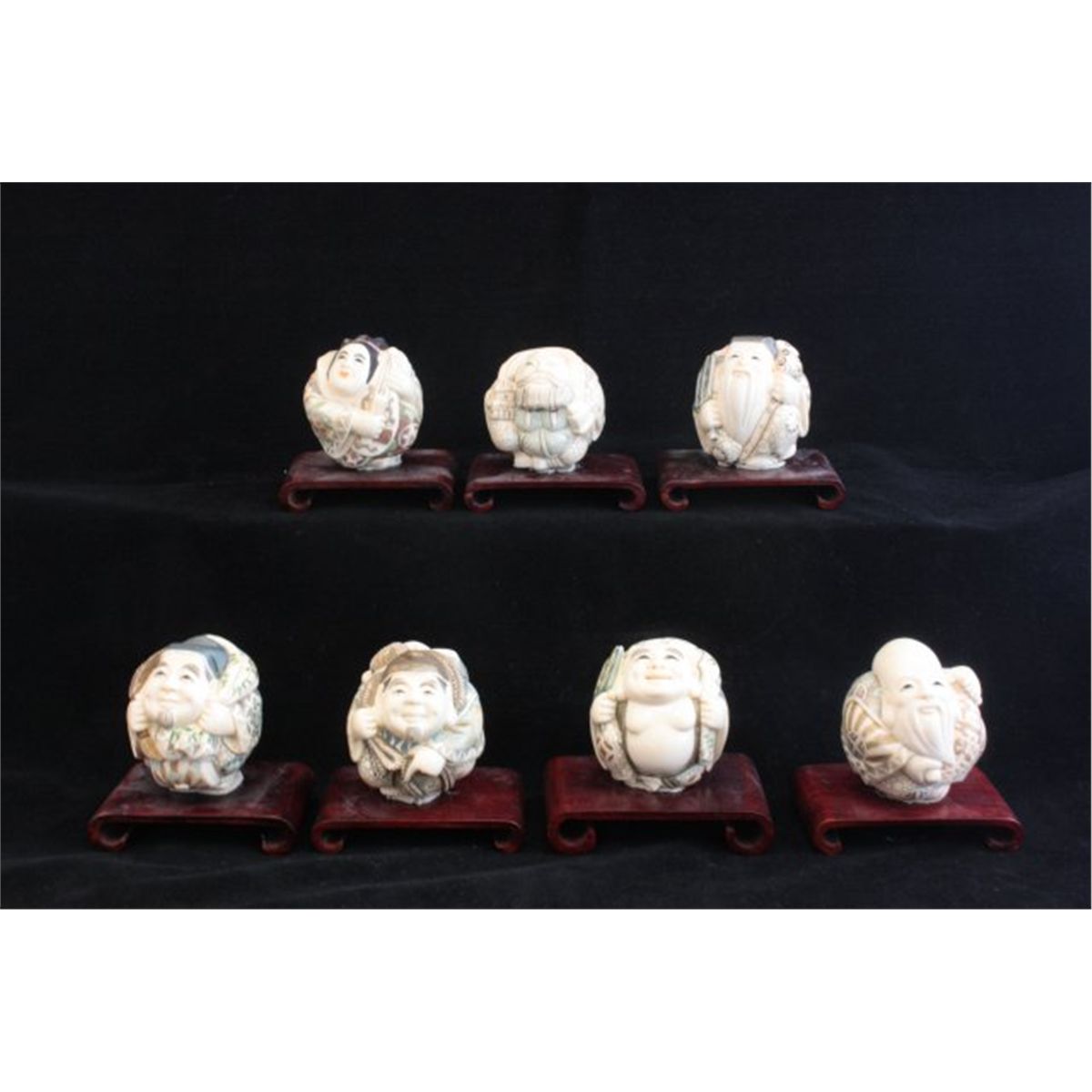 Chinese carved ivory on rosewood bases