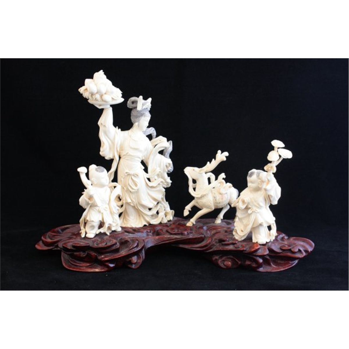 Chinese carved ivory on rosewood base