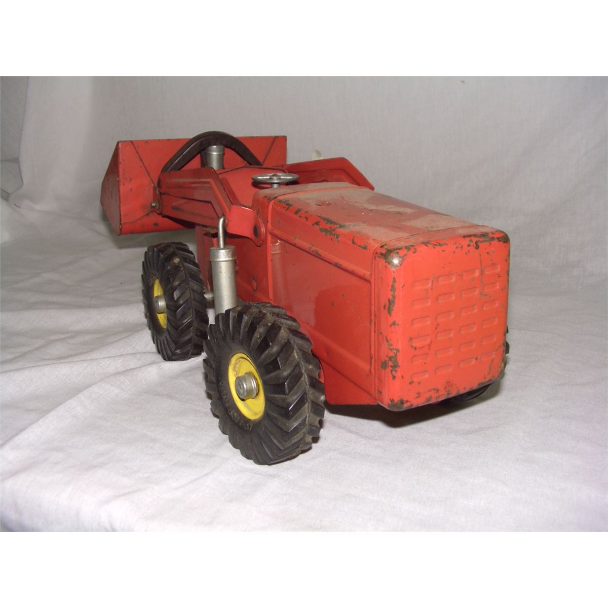 vintage metal crank pay loader toy
