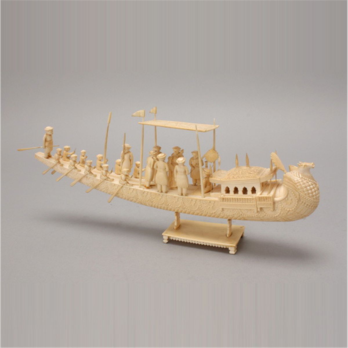 A Carved Ivory Boat and Figures*