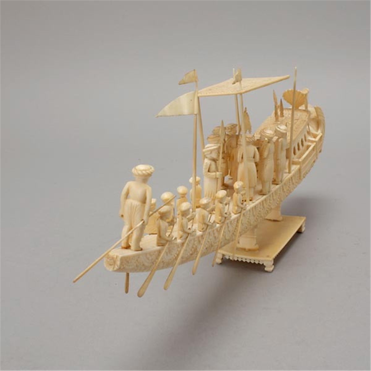 A Carved Ivory Boat and Figures*