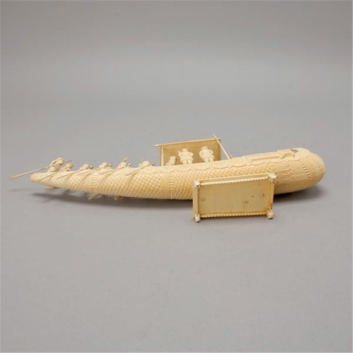 A Carved Ivory Boat and Figures*