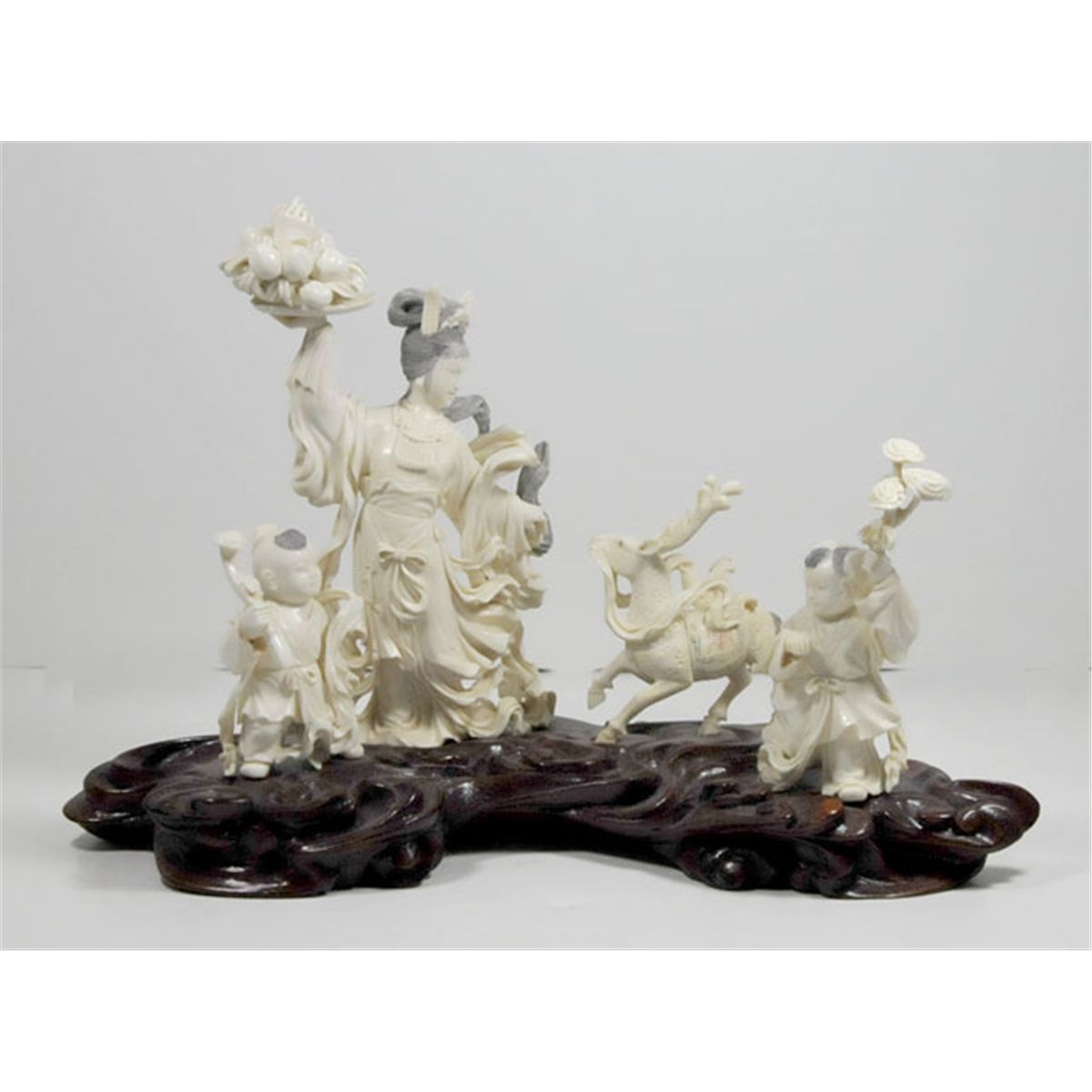Chinese carved ivory on rosewood base