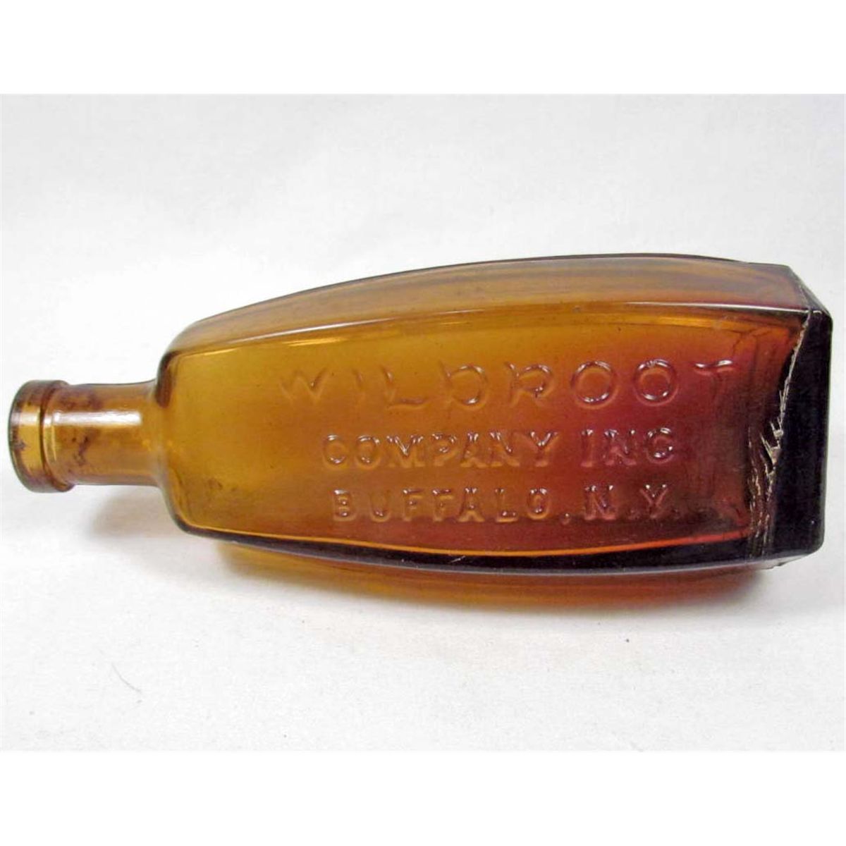 1448 - VINTAGE BROWN GLASS BOTTLE " WILDROOT COMPANY INC. BUFFALO N.Y."