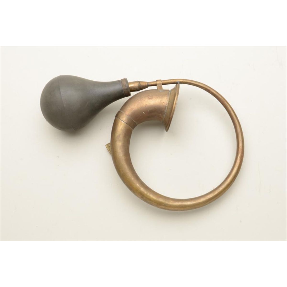 Brass circular horn with black rubber air bulb in uncleaned condition ...