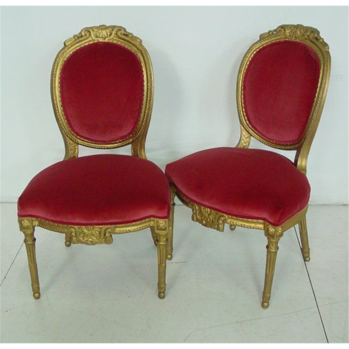 Pair carved gold rimmed upholstered side chairs