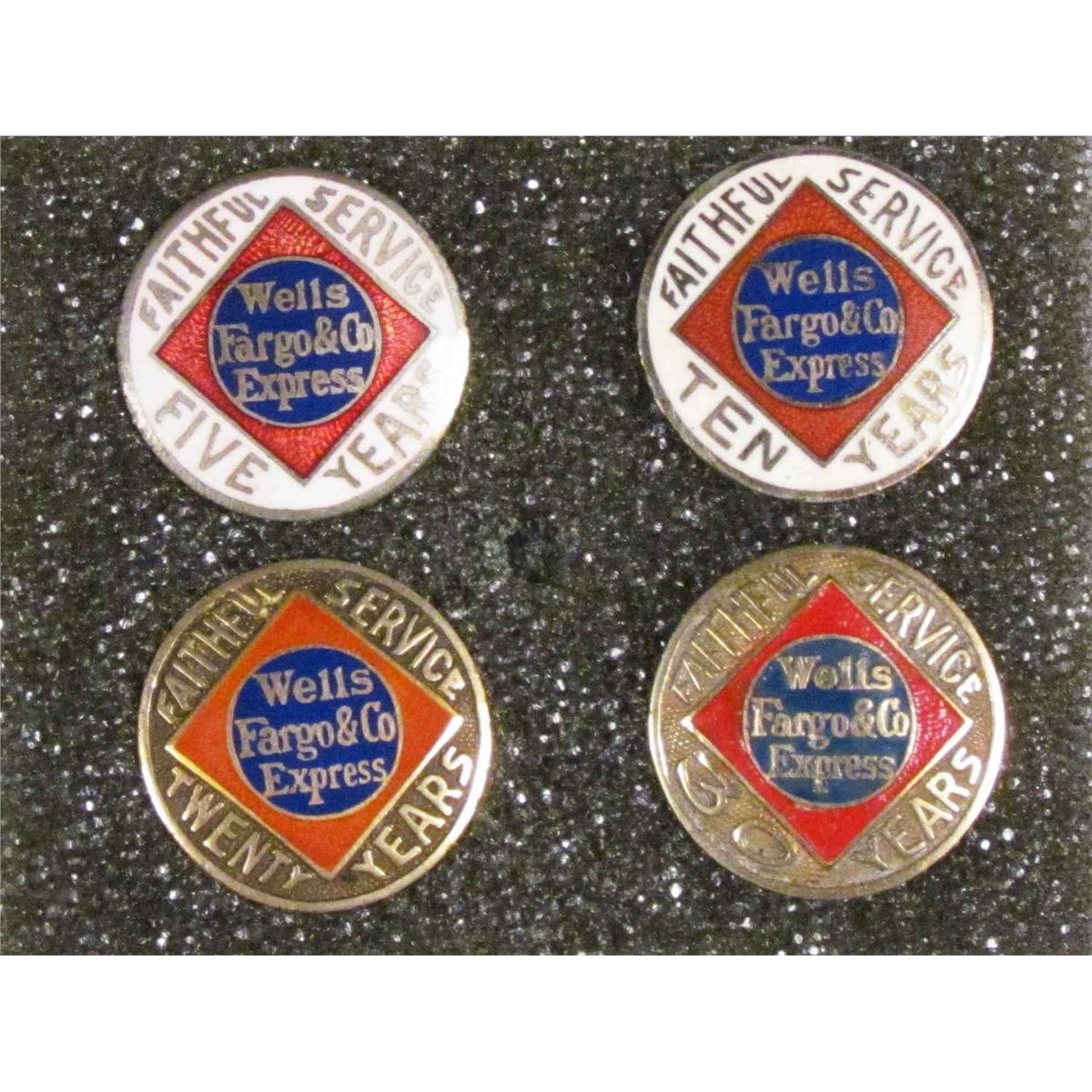 Four Wells Fargo Faithful Service Pins