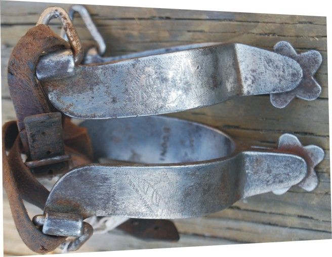 Boone etched iron spurs
