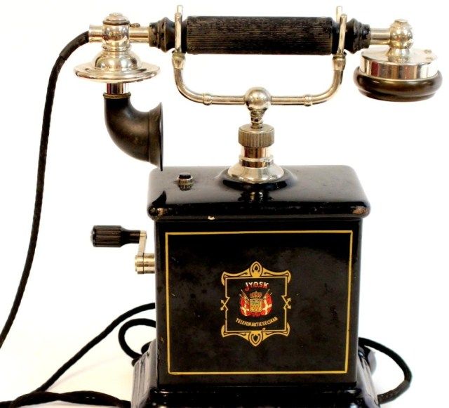Classic antique hand crank telephone with black enamel base marked ...