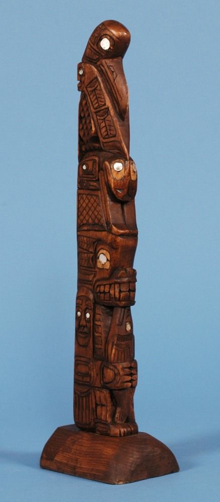 Tsimshian Totem Carved with Raven, Bear Holding Salmon and Faces on the ...