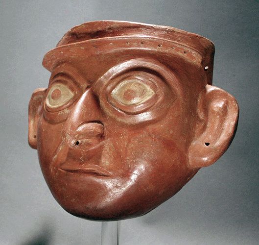 A Moche Pottery Mask Perforated Ears