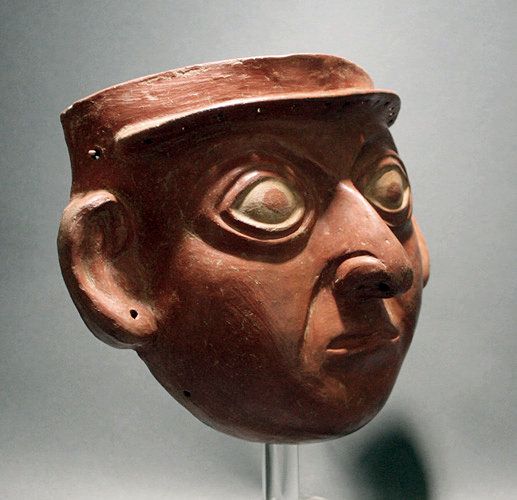 A Moche Pottery Mask Perforated Ears