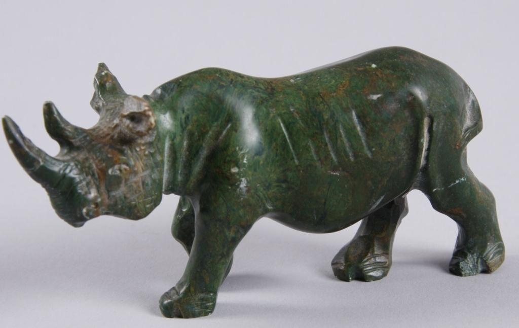 Green Carved Hard Stone Rhino FigurineLots of great patina, measures 5"X2".