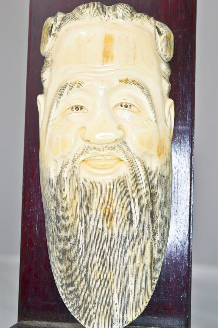 Antique Chinese carved ivory emperor faces