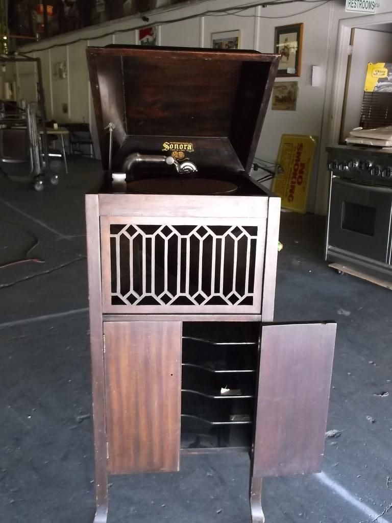 antique Sonora phonograph with many antique record