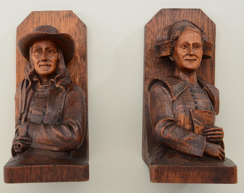 Finely carved old oak bookends showing an early pilgrim man and early ...
