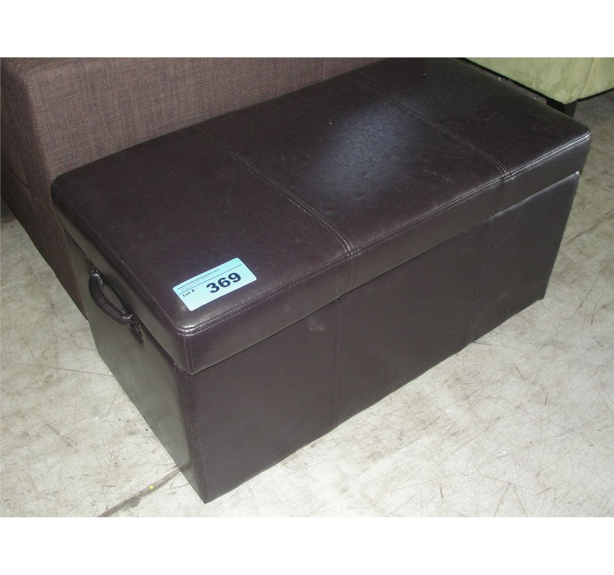 Brown leather storage trunk / footstool
