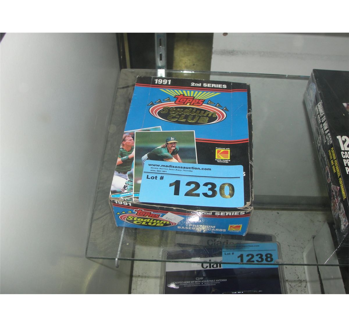 One box of sports collectors trading cards