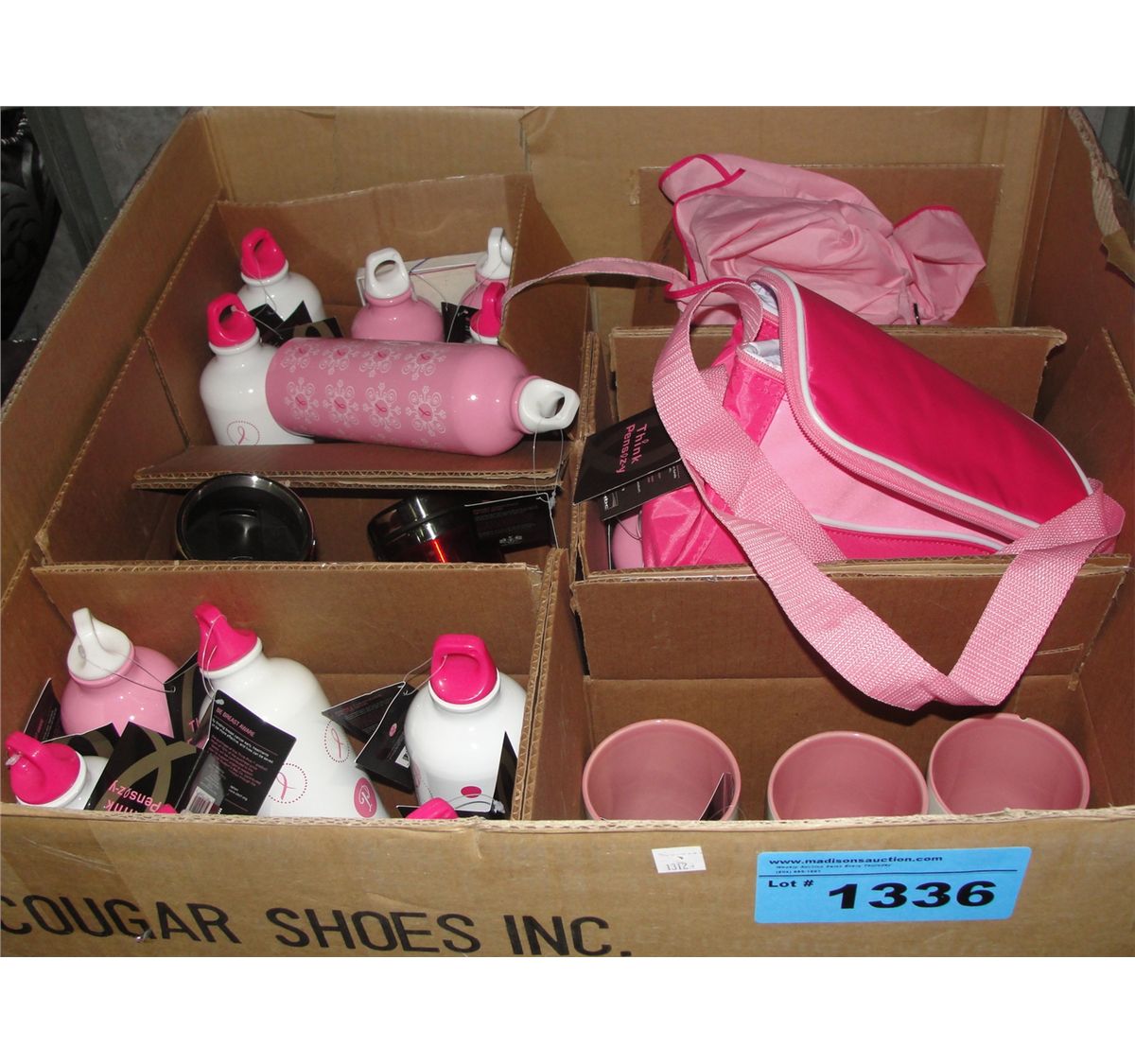 Box of new think pink water containers, coffee