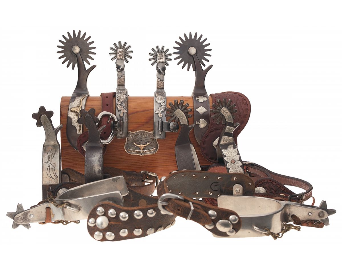 Five Pairs of Western Spurs and a Spur Block