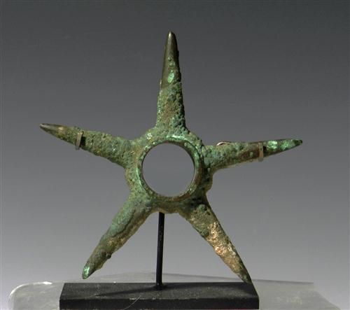 An Inca Bronze Star-Shaped Mace Head