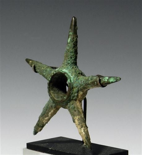 An Inca Bronze Star-Shaped Mace Head
