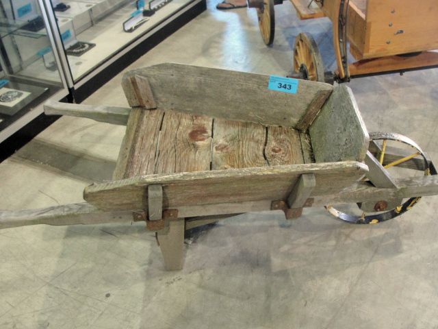 Rustic wooden wheel barrow with steel wheel