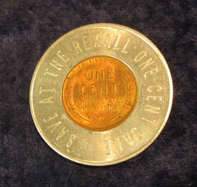 21. 1952 D Encased Lincoln Cent. "Save at the Rexall One Cent Sale". EF.