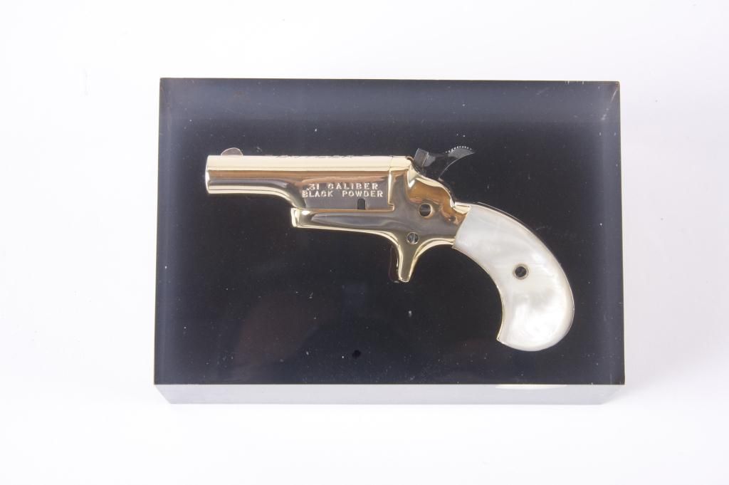Gun PaperweightShows a Butler .31 Caliber black powder gold derringer ...