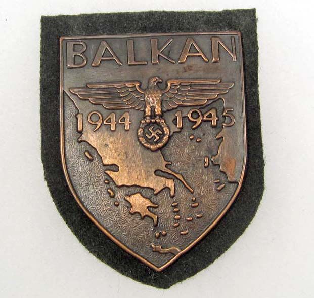 GERMAN NAZI BALKAN BRASS SHIELD W/ GREEN WOOL BACKING