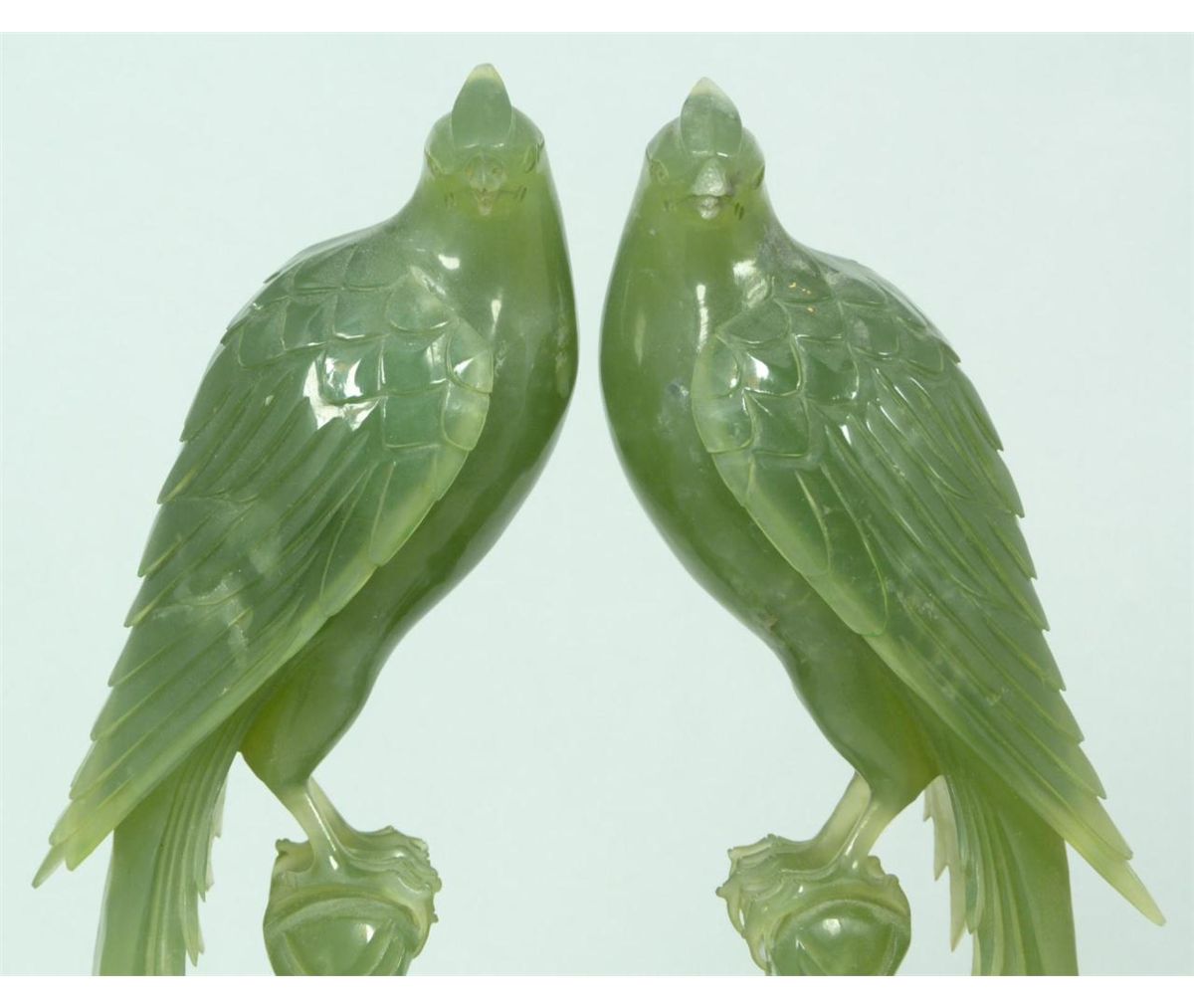 A PAIR OF CHINESE CARVED JADE BIRD FIGURES
