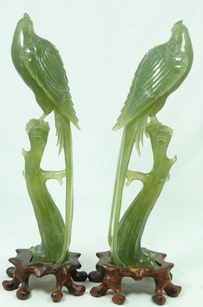 A PAIR OF CHINESE CARVED JADE BIRD FIGURES