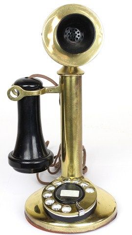 Antique brass candlestick phone.
