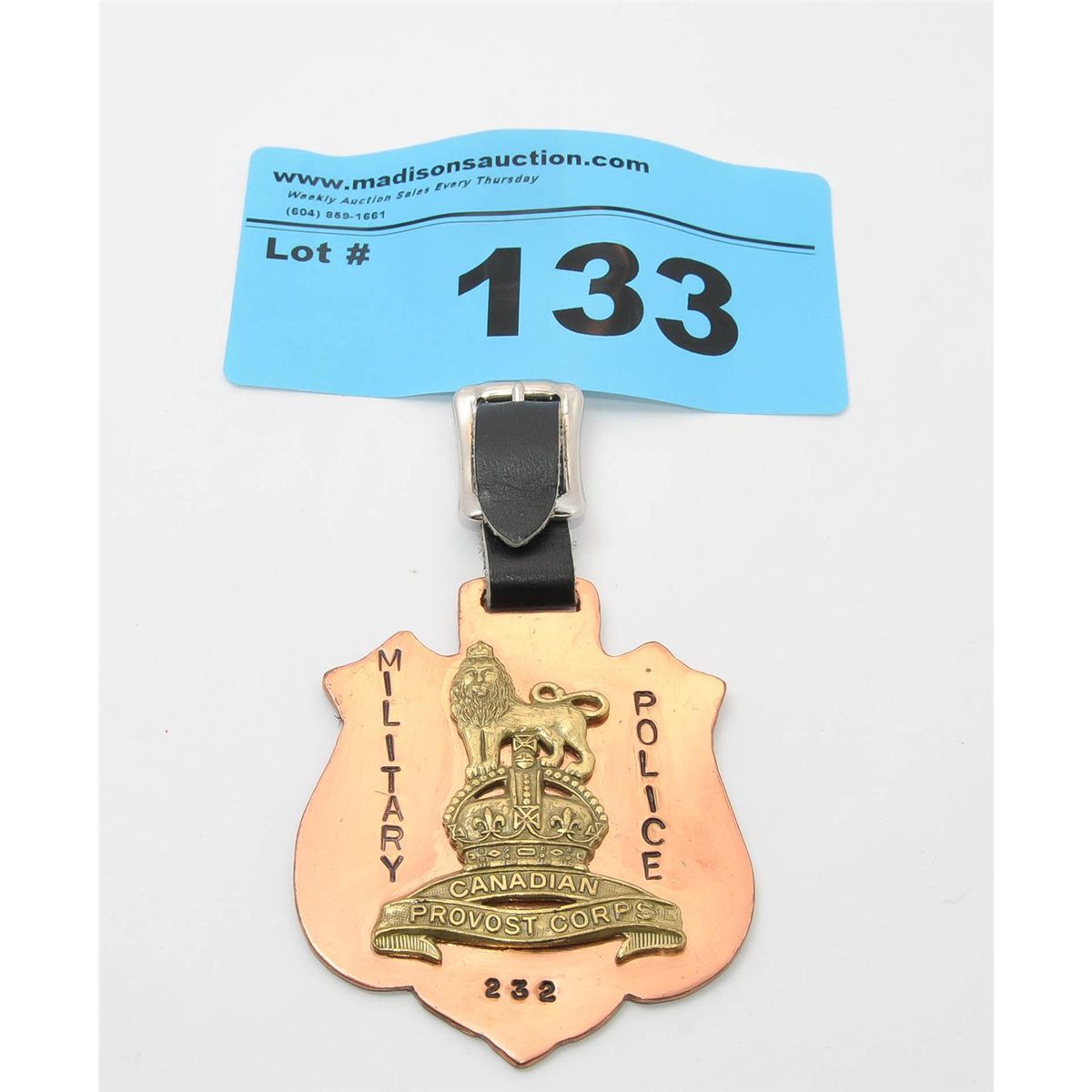 Copper and brass military police badge